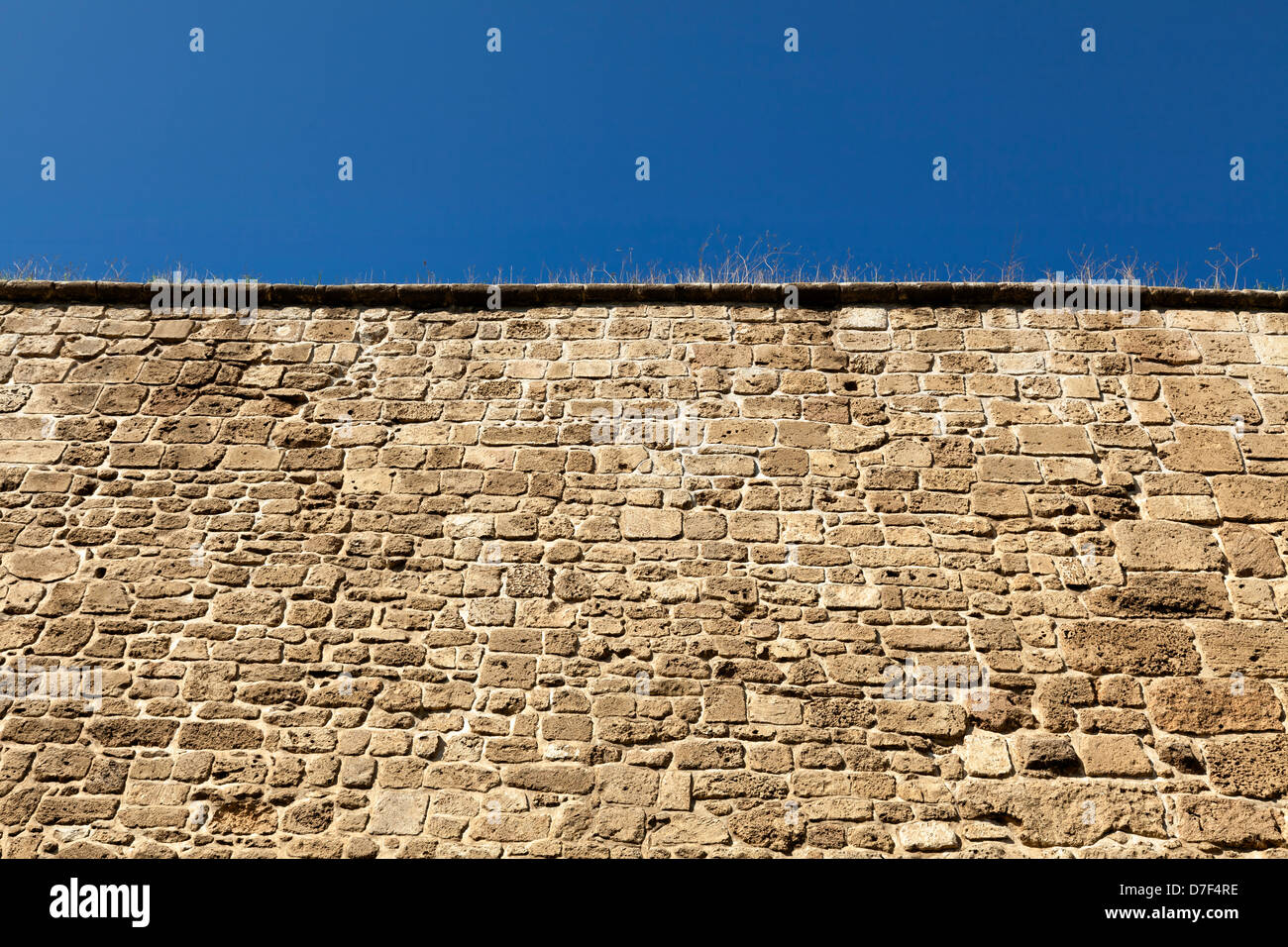 Low angle view of part of a stone wall, located at the old city of Acco ...