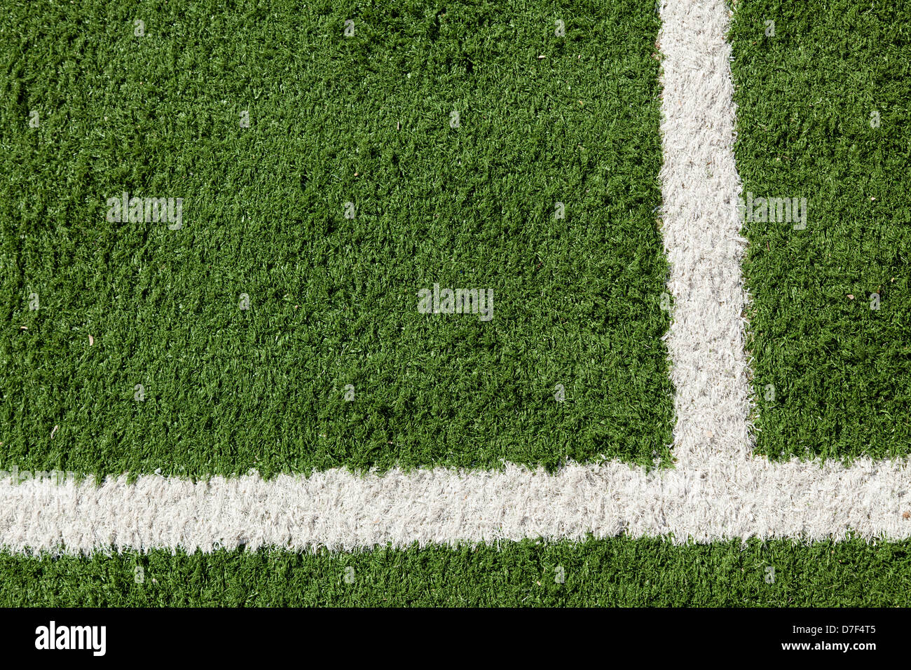 Close up of artificaial lawn painted on with white stripes. Part of a ...