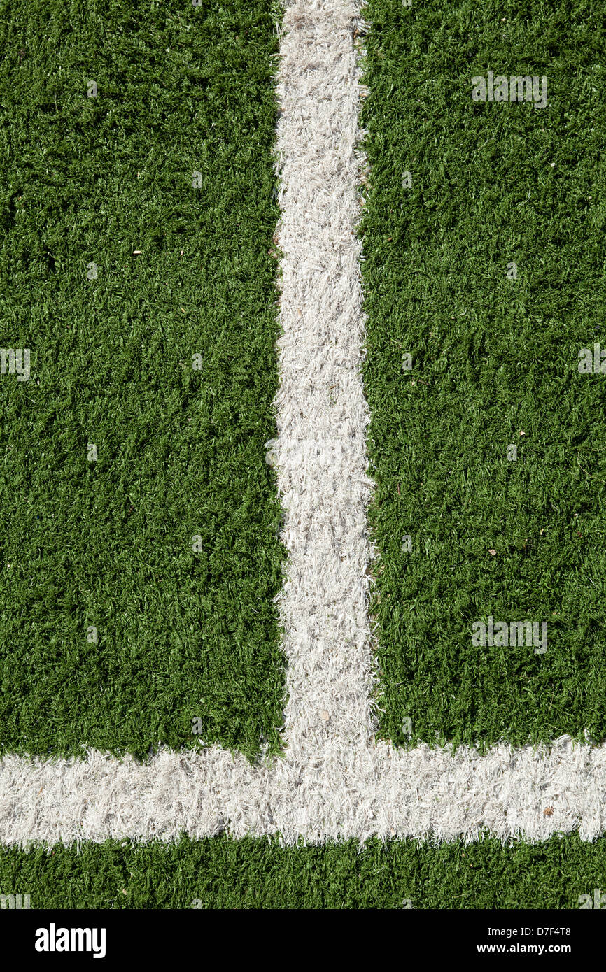 Close up of artificaial lawn painted on with white stripes. Part of a ...