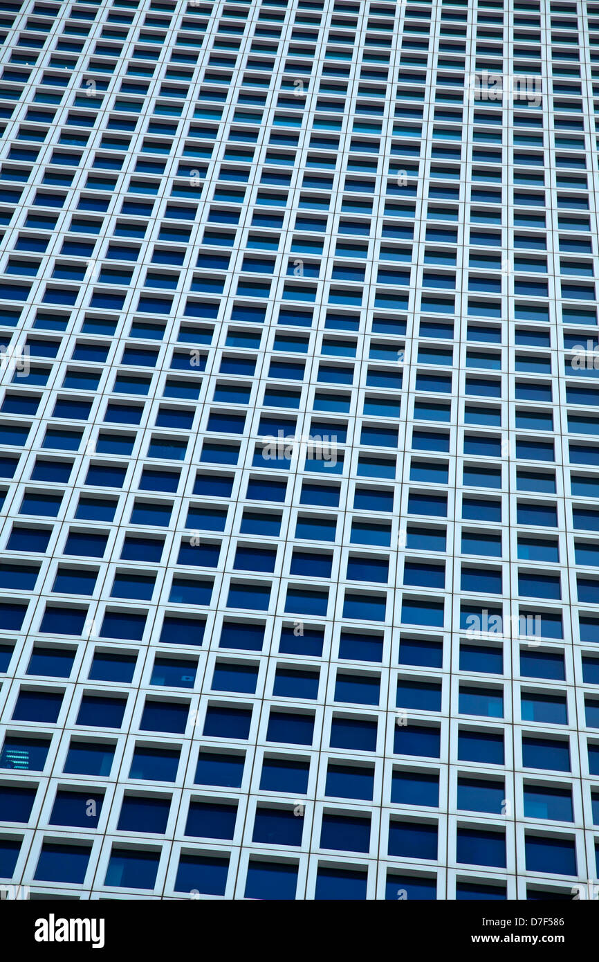 A large amount of identical square windows of a skyscraper. Shot from a ...