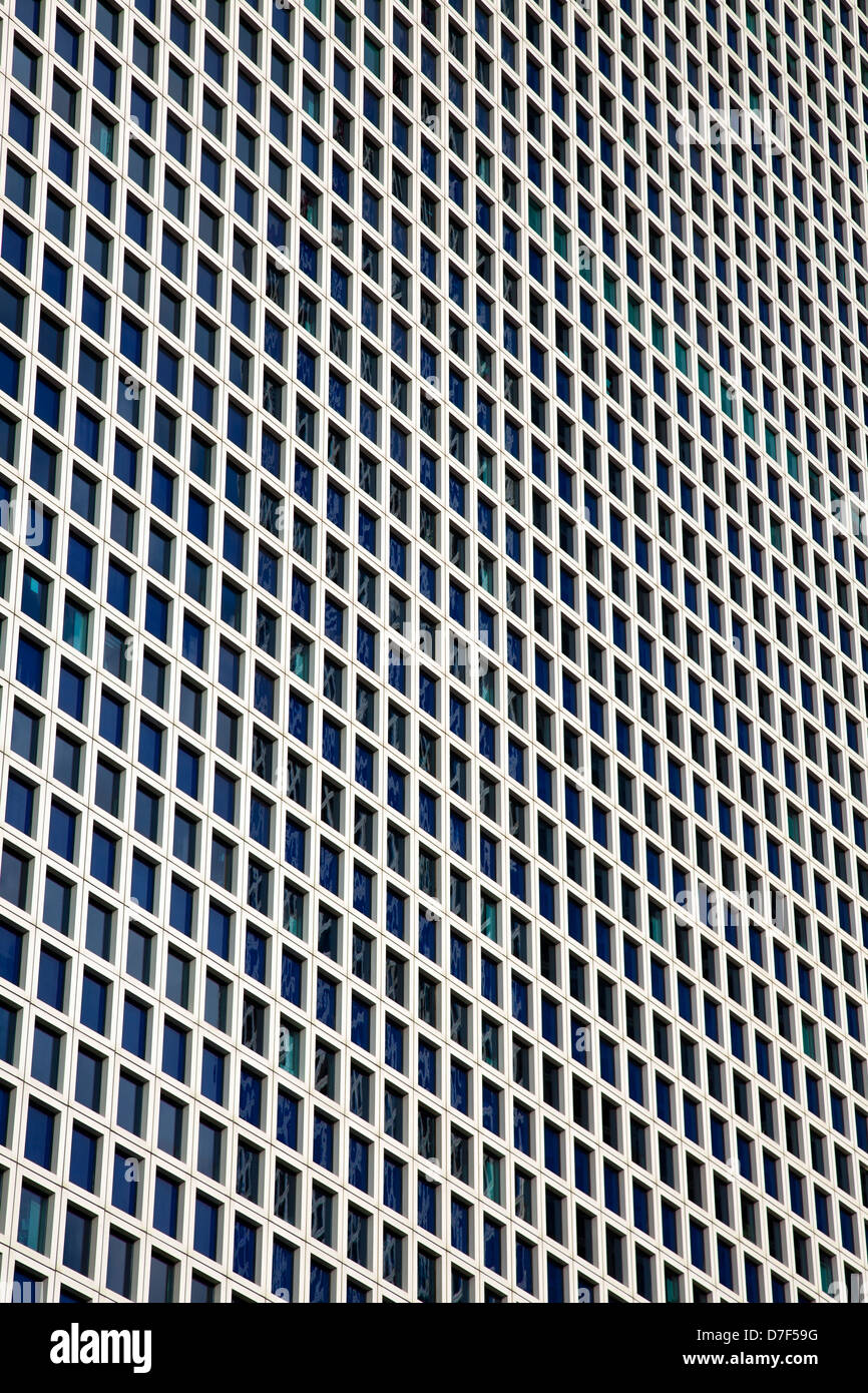 A large amount of identical square windows of a skyscraper. Shot from a ...