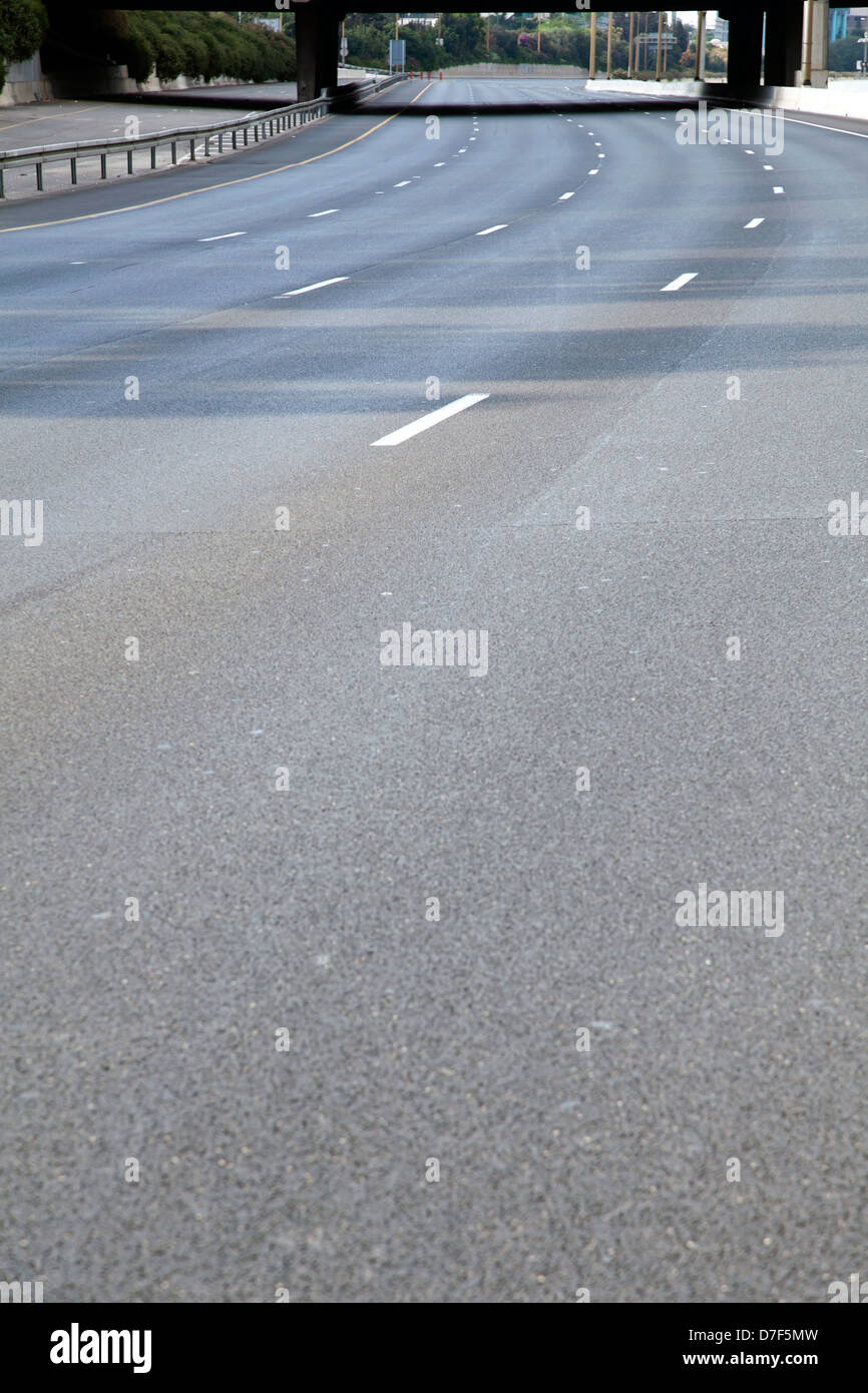 A four lane highway completely empty from traffic Stock Photo - Alamy