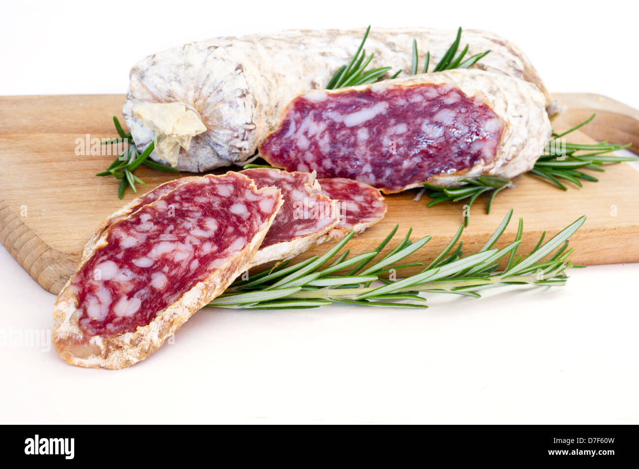 Slices of Salame from Italy on Wooden table Stock Photo - Alamy