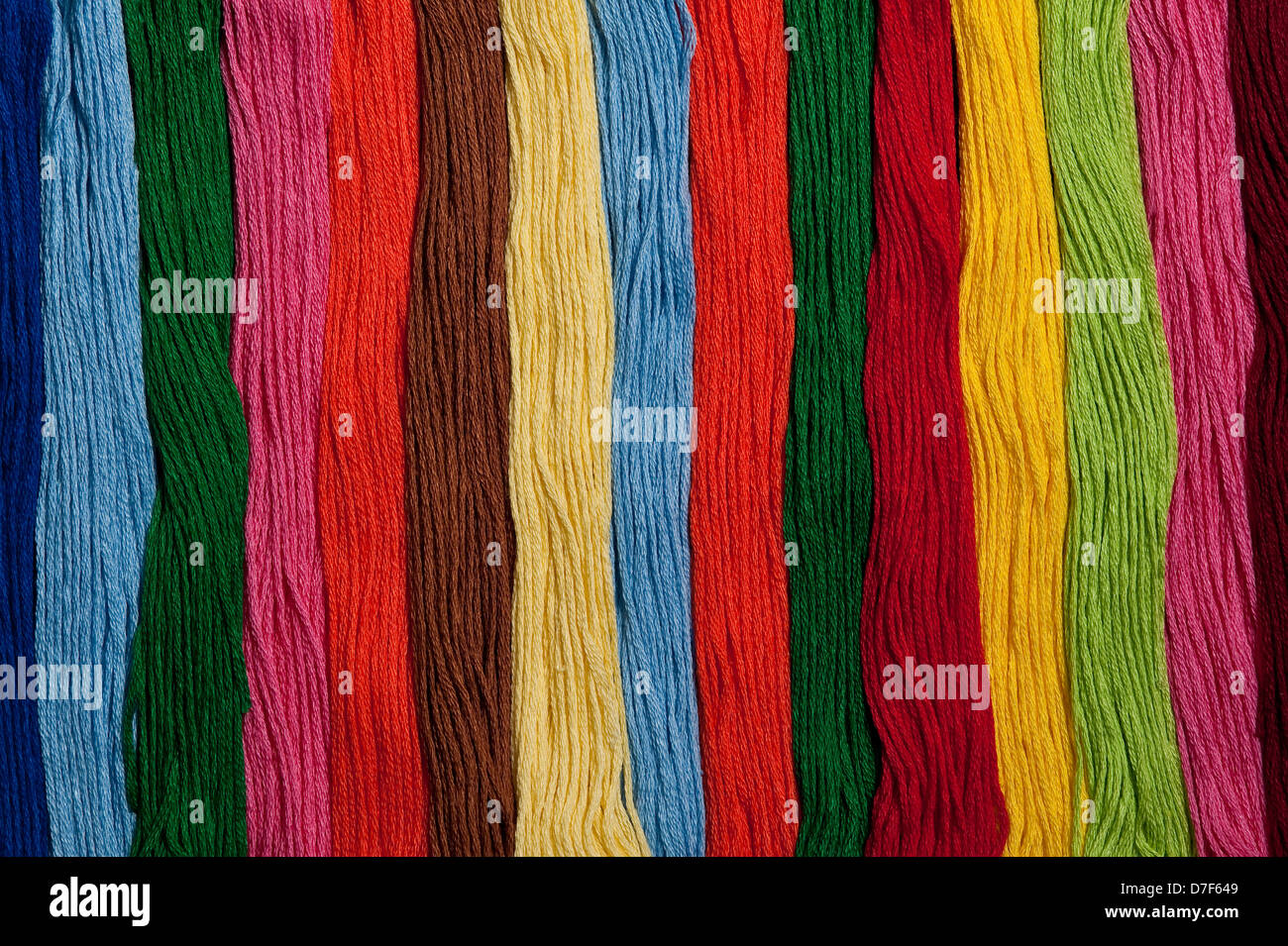 Multicolored embroidery thread in rows, patterns of colors Stock Photo ...