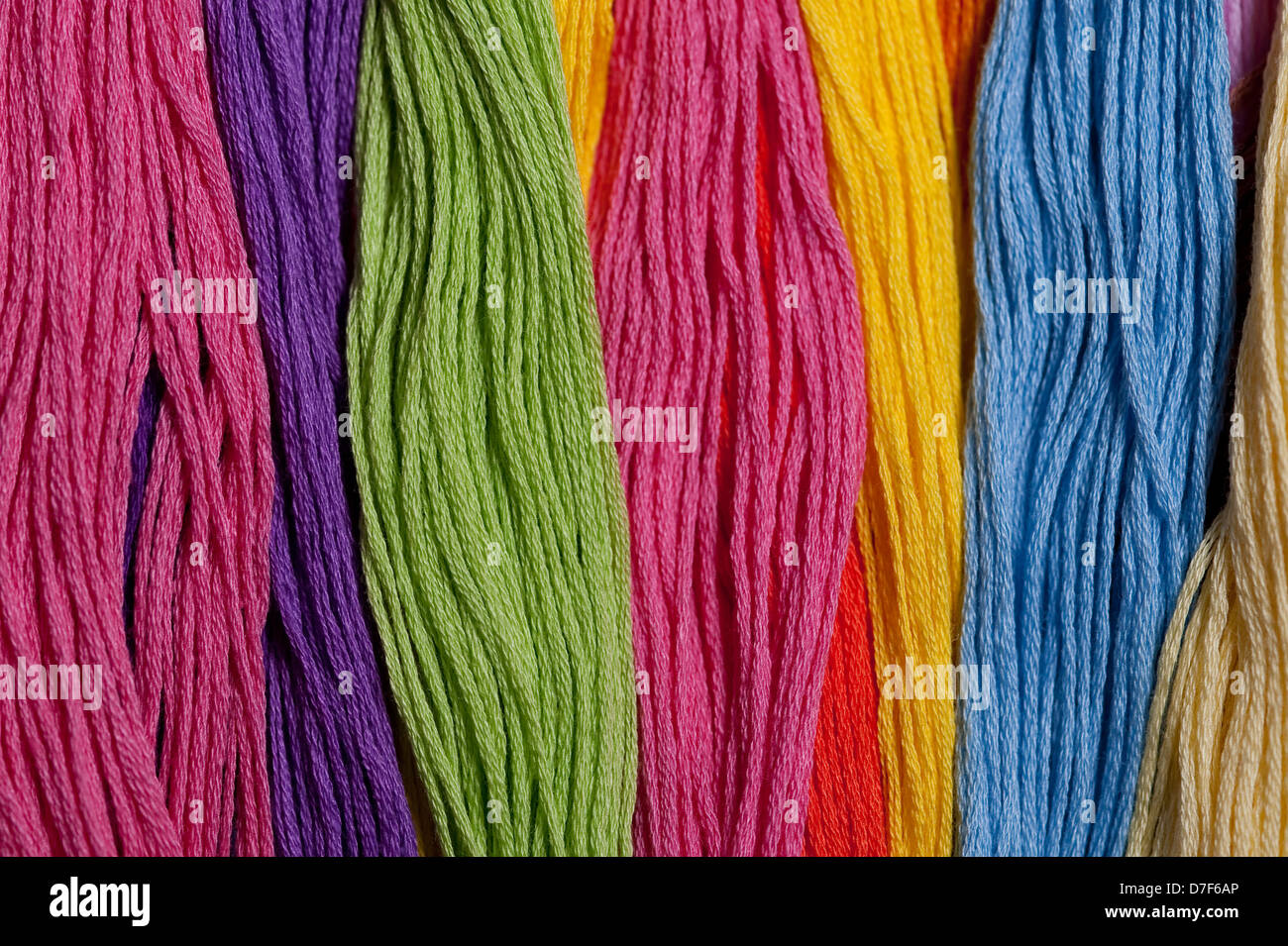Multicolored embroidery thread in rows, patterns of colors Stock Photo ...