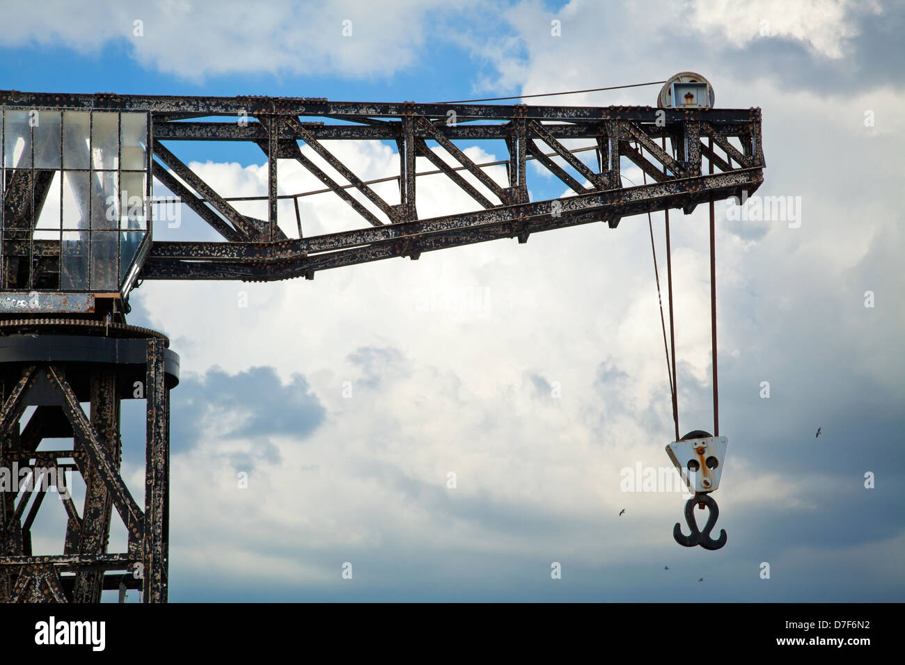 Silhouette vintage run-down crane in Tel-Aviv harbour. This crane has ...