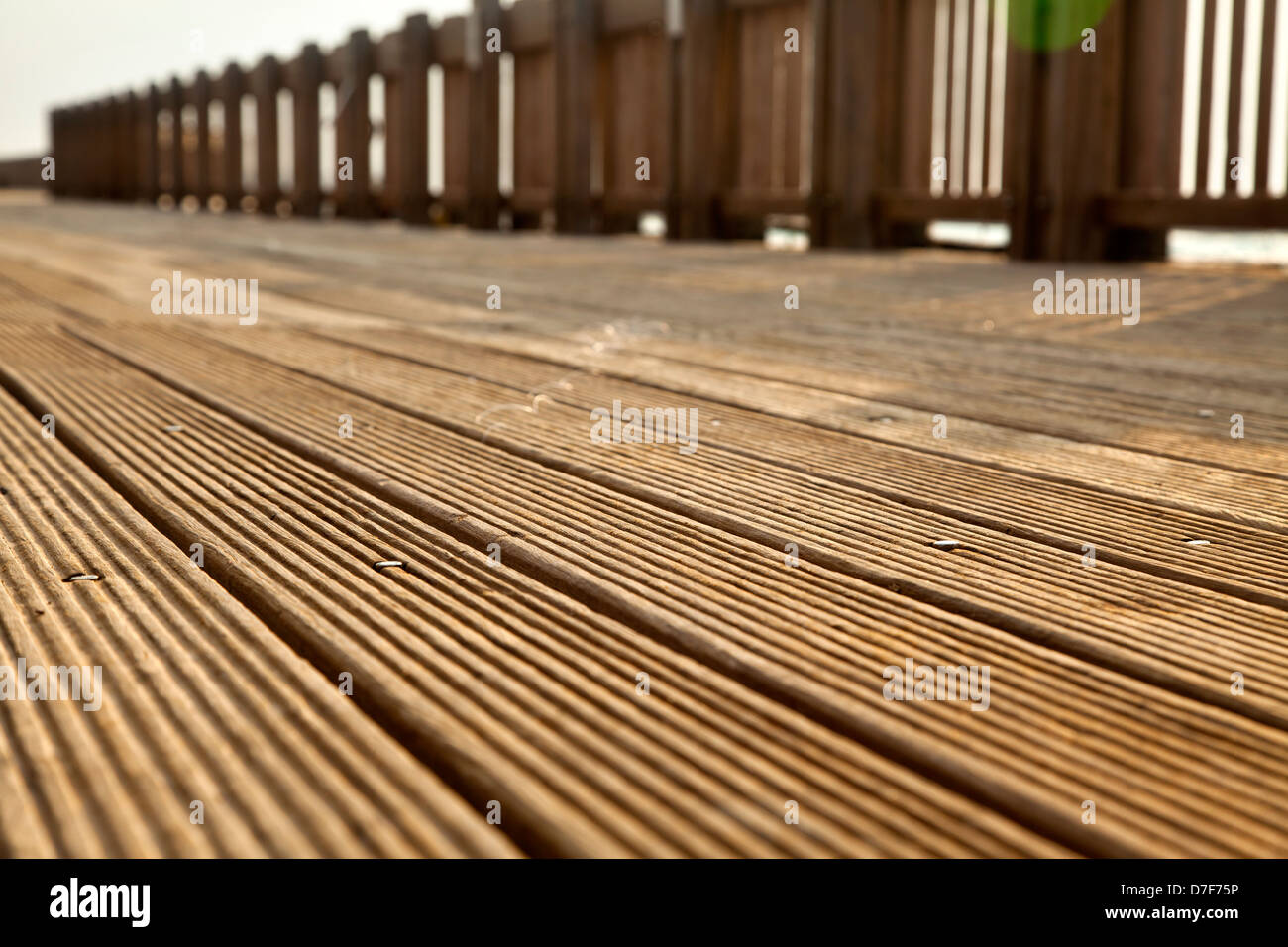 A wooden deck footpath in the sunlight, diminishing pespective Stock ...
