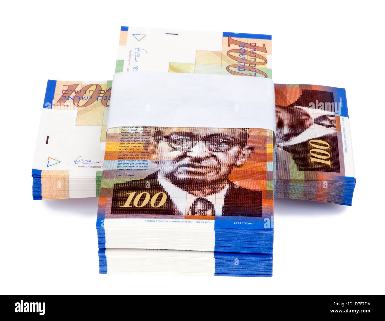 Three stacks of 100 NIS (New Israeli Shekel) money notes on top of ...