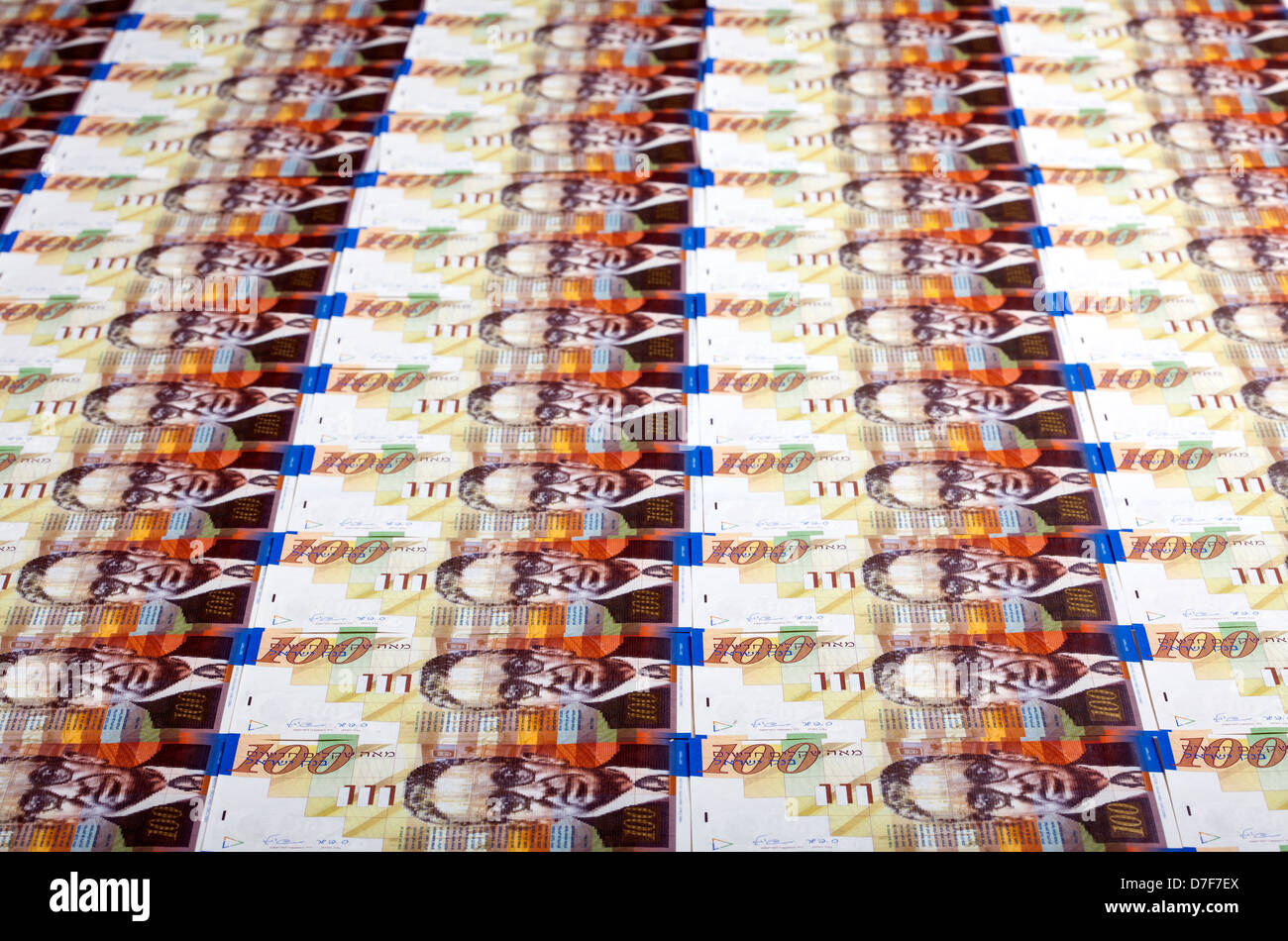 A high angle view of a very large amount of 100 NIS (New Israeli Shekel ...