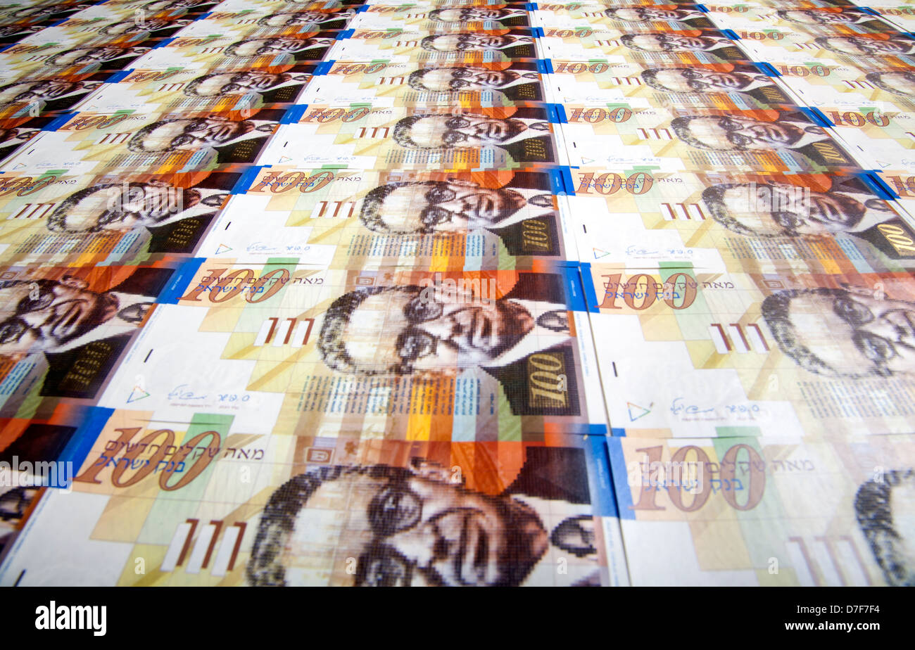 A high angle view of a very large amount of 100 NIS (New Israeli Shekel ...