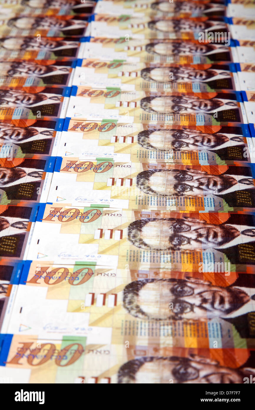 A high angle view of a very large amount of 100 NIS (New Israeli Shekel ...