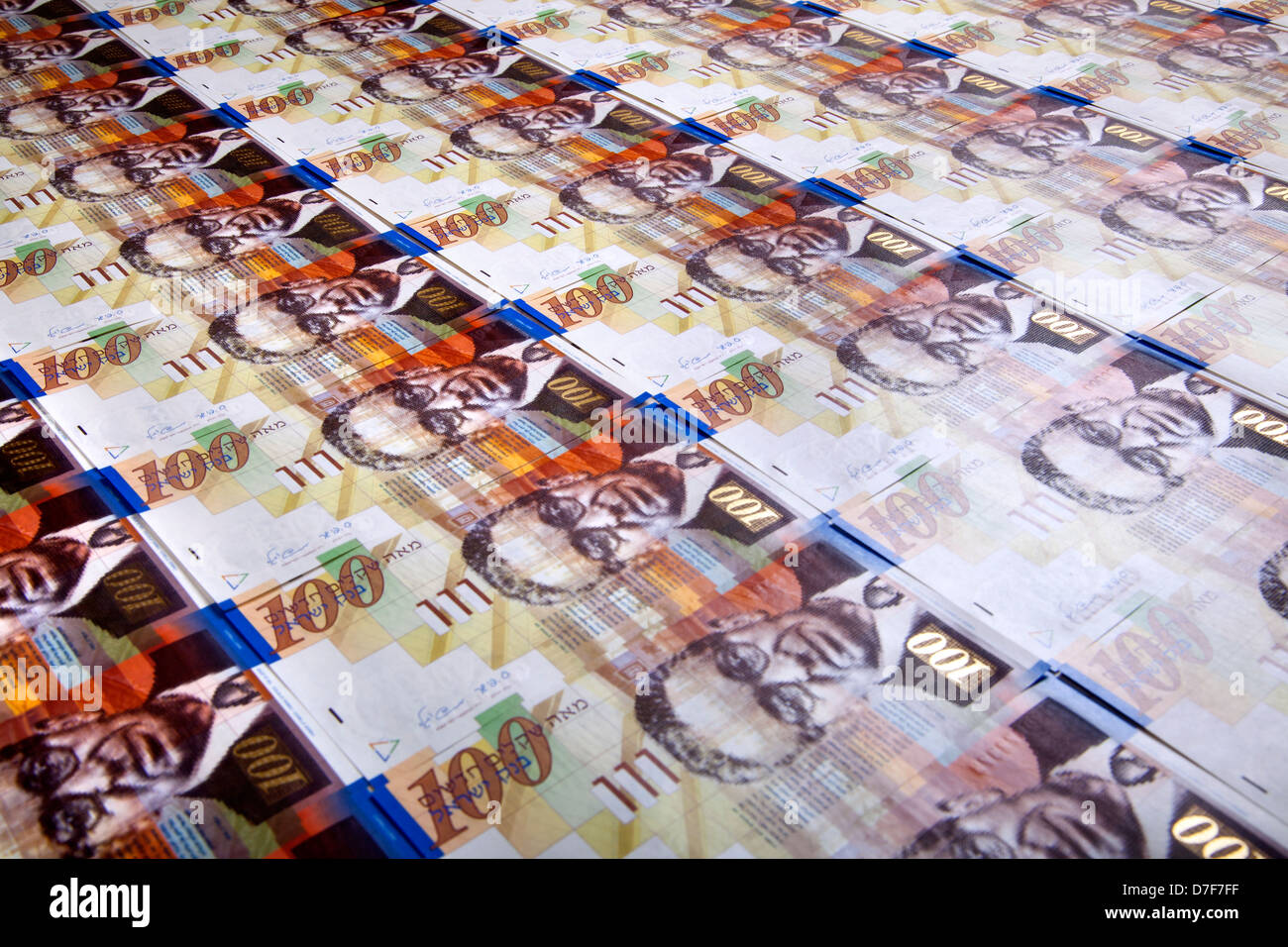 A high angle view of a very large amount of 100 NIS (New Israeli Shekel ...