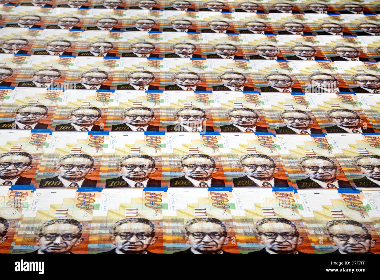 A high angle view of a very large amount of 100 NIS (New Israeli Shekel ...