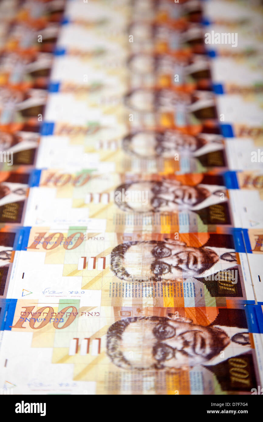 A high angle view of a very large amount of 100 NIS (New Israeli Shekel ...