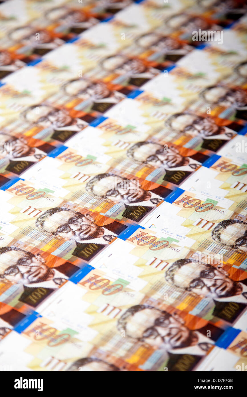 A high angle view of a very large amount of 100 NIS (New Israeli Shekel ...