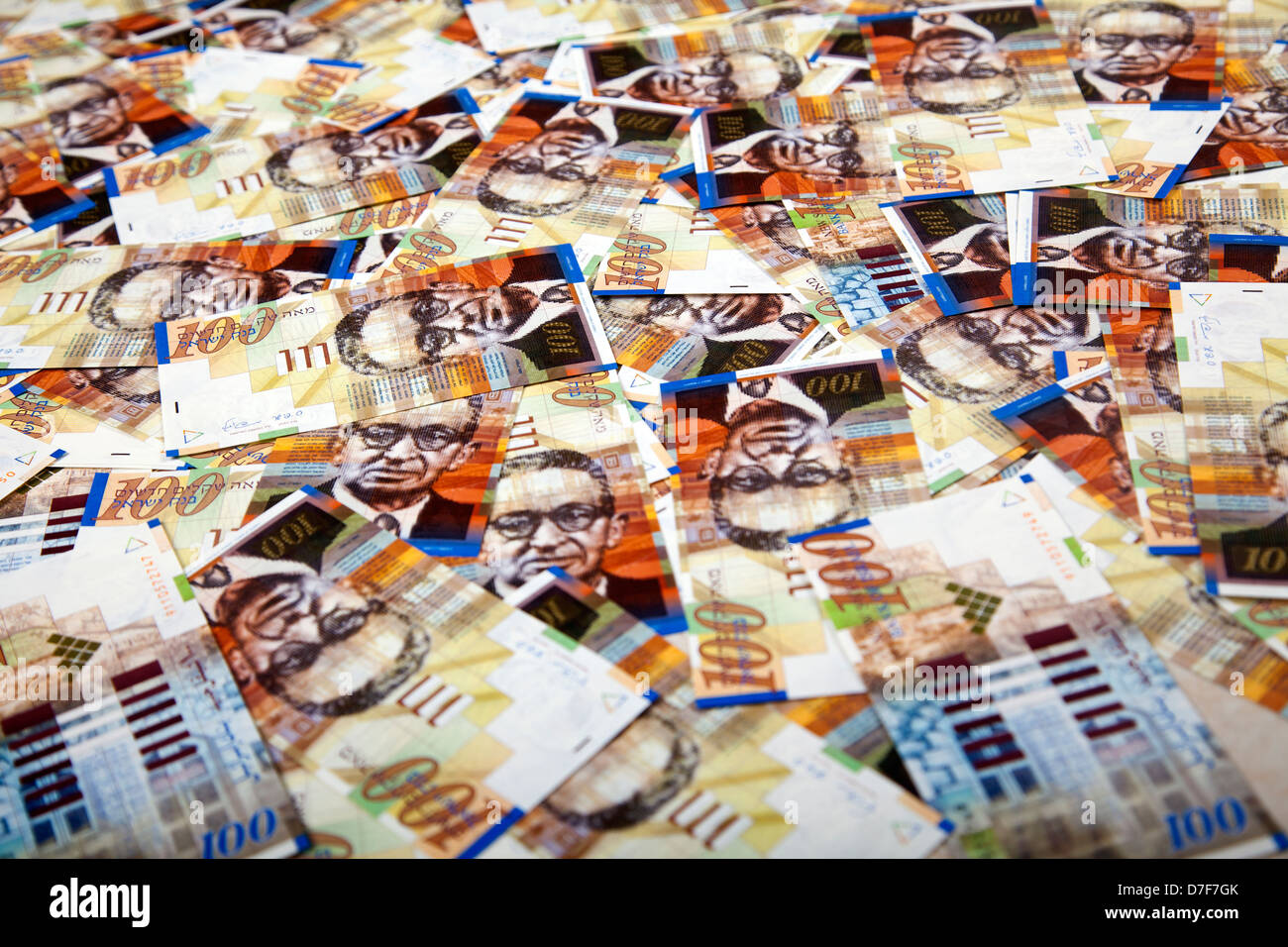 A high angle view of a very large amount of 100 NIS (New Israeli Shekel ...