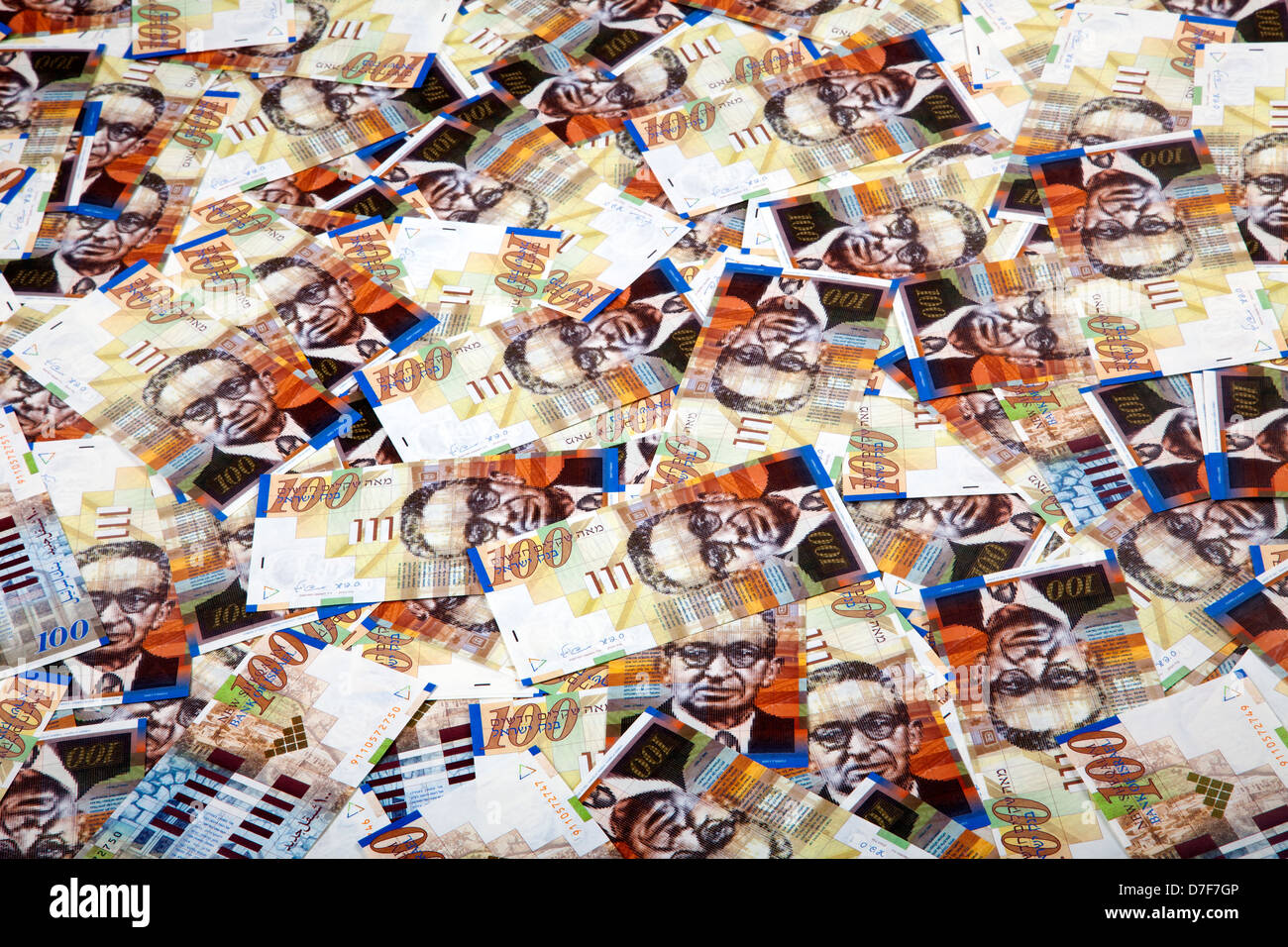 A high angle view of a very large amount of 100 NIS (New Israeli Shekel ...