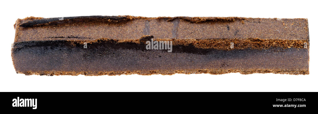 A 10 grams piece of Hashish isolated on white background. This piece ...