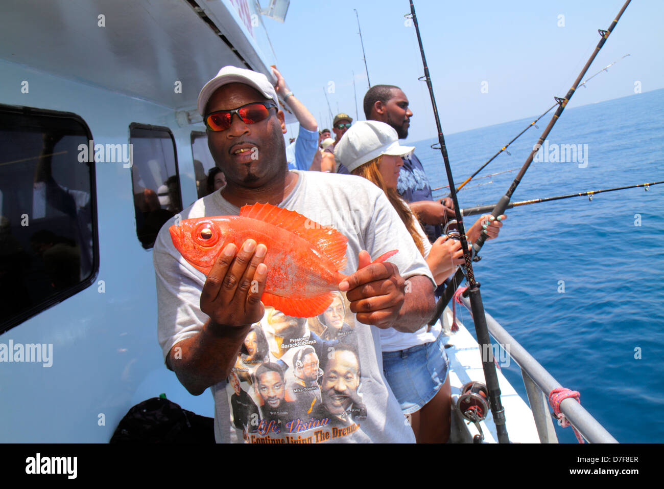 Black man rods deep sea snapper holds holding catch hi-res stock ...