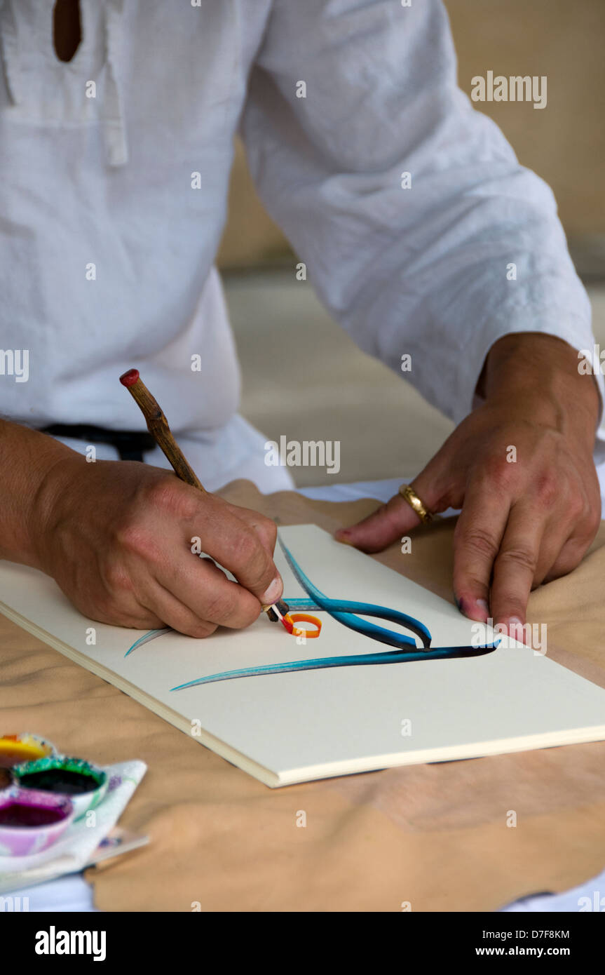 Man demonstrating calligraphy Stock Photo - Alamy