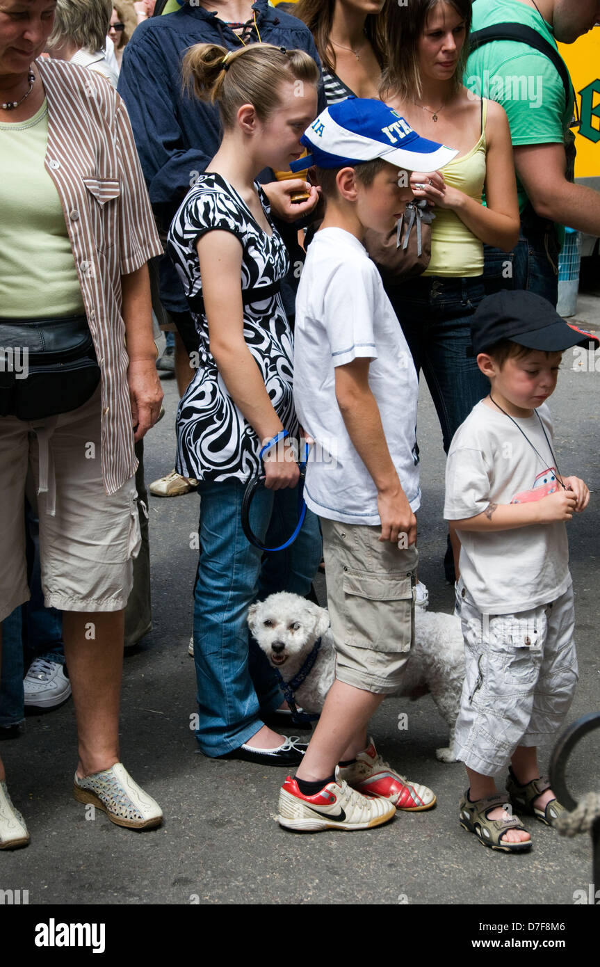 Family with dog watching performance Stock Photo - Alamy