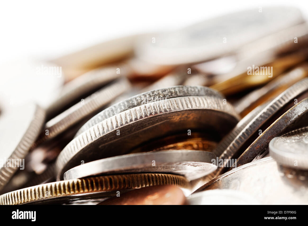 Macro shot of a large quantity of unrecognizable coins stacked in chaos ...