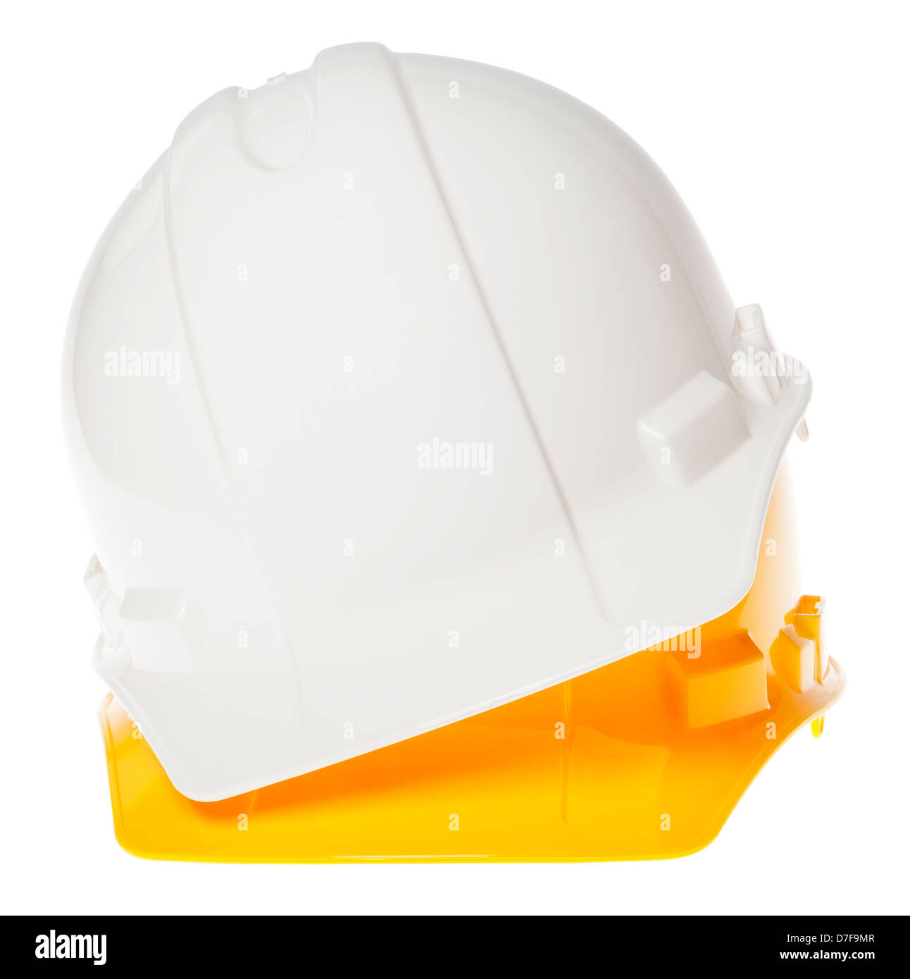 Frontal view of two hard hats, white on top of yellow, isolated on ...