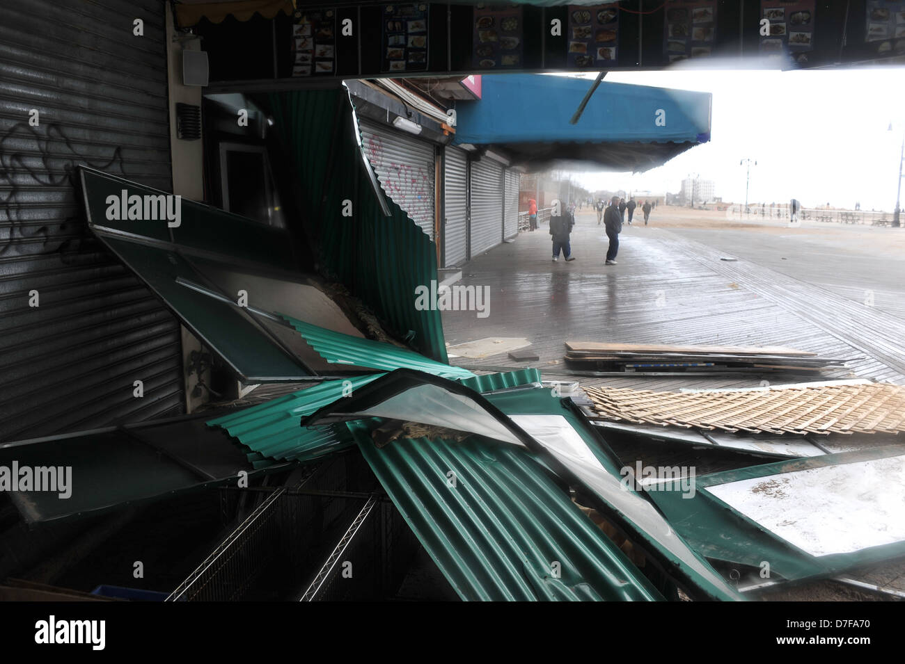 BROOKLYN, NY - OCTOBER 30: Damaged roof of restaurant on the boardwalk ...