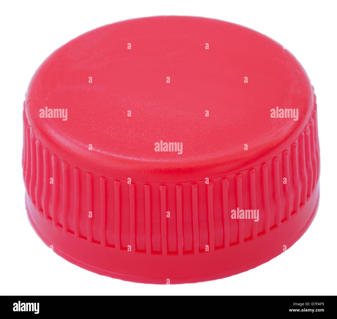 Single red plastic bottle cap isolated on white background. Top side ...