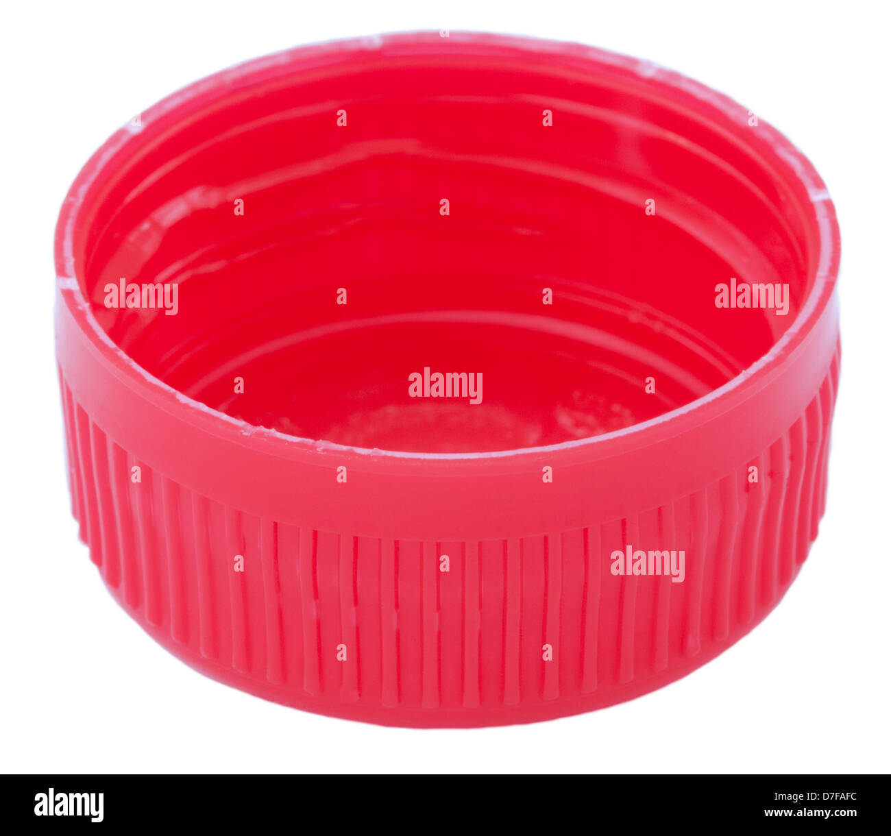 The bottom side of a red plastic bottle cap isolated on white ...