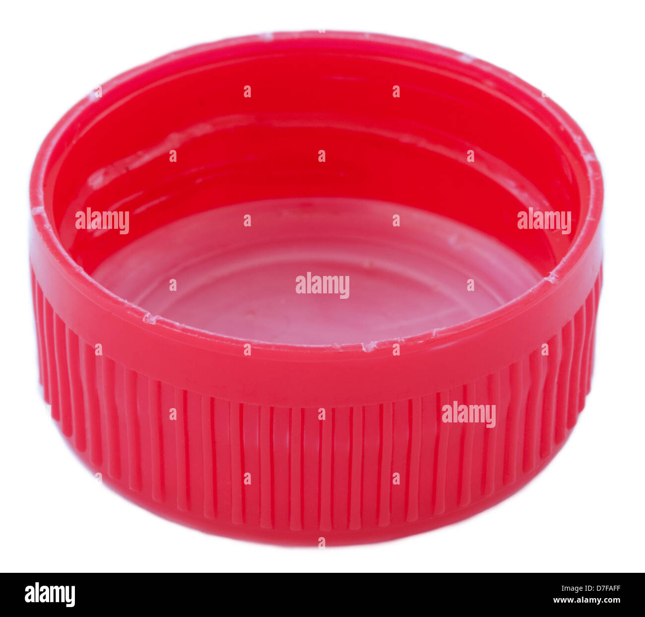 Single red colored plastic bottle cap isolated on white background ...