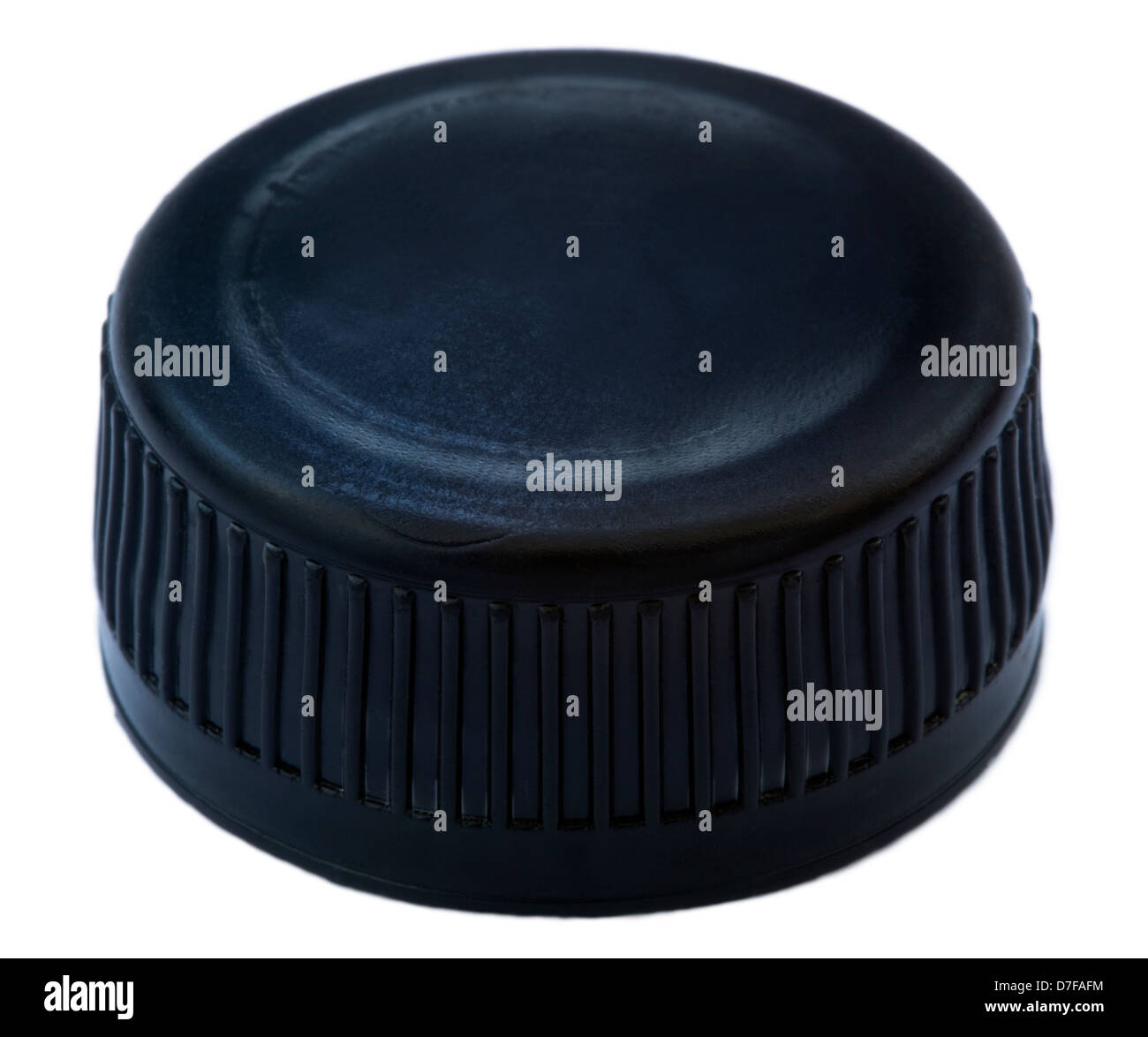 Single black colored plastic bottle cap isolated on white background ...