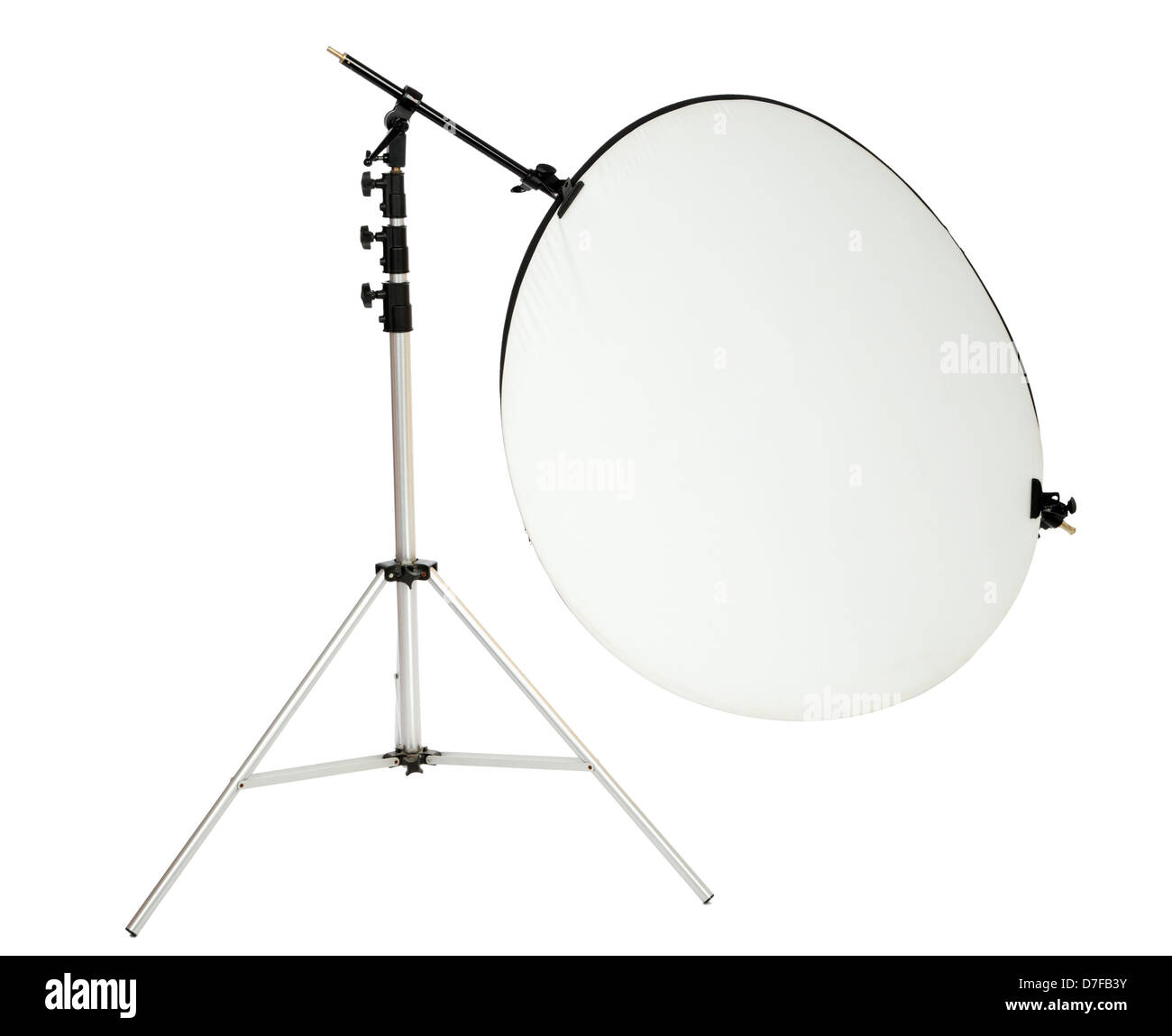 Round white reflector held by designated holder set on lighting stand ...