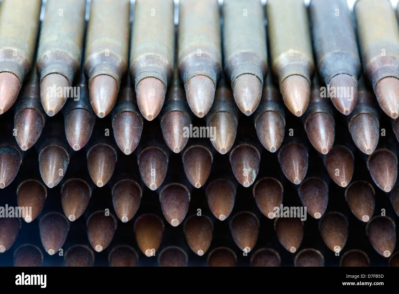 A stack of 5.56mm rifle cartridges. Shot from a high angle Stock Photo ...