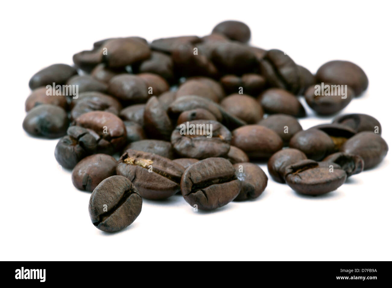 A cluster of fresh roasted coffee beans isolated on white background ...