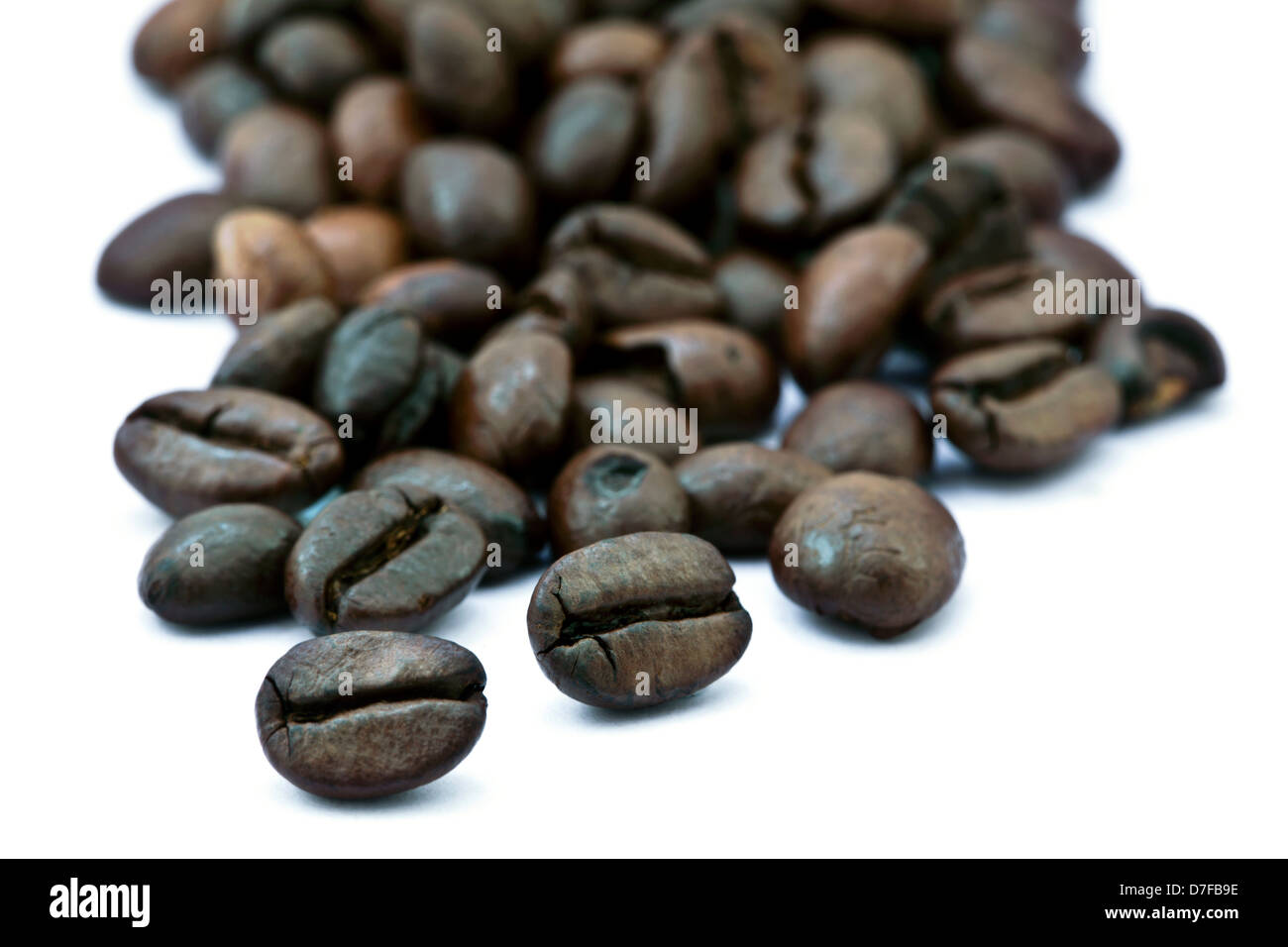 A cluster of fresh roasted coffee beans isolated on white background ...