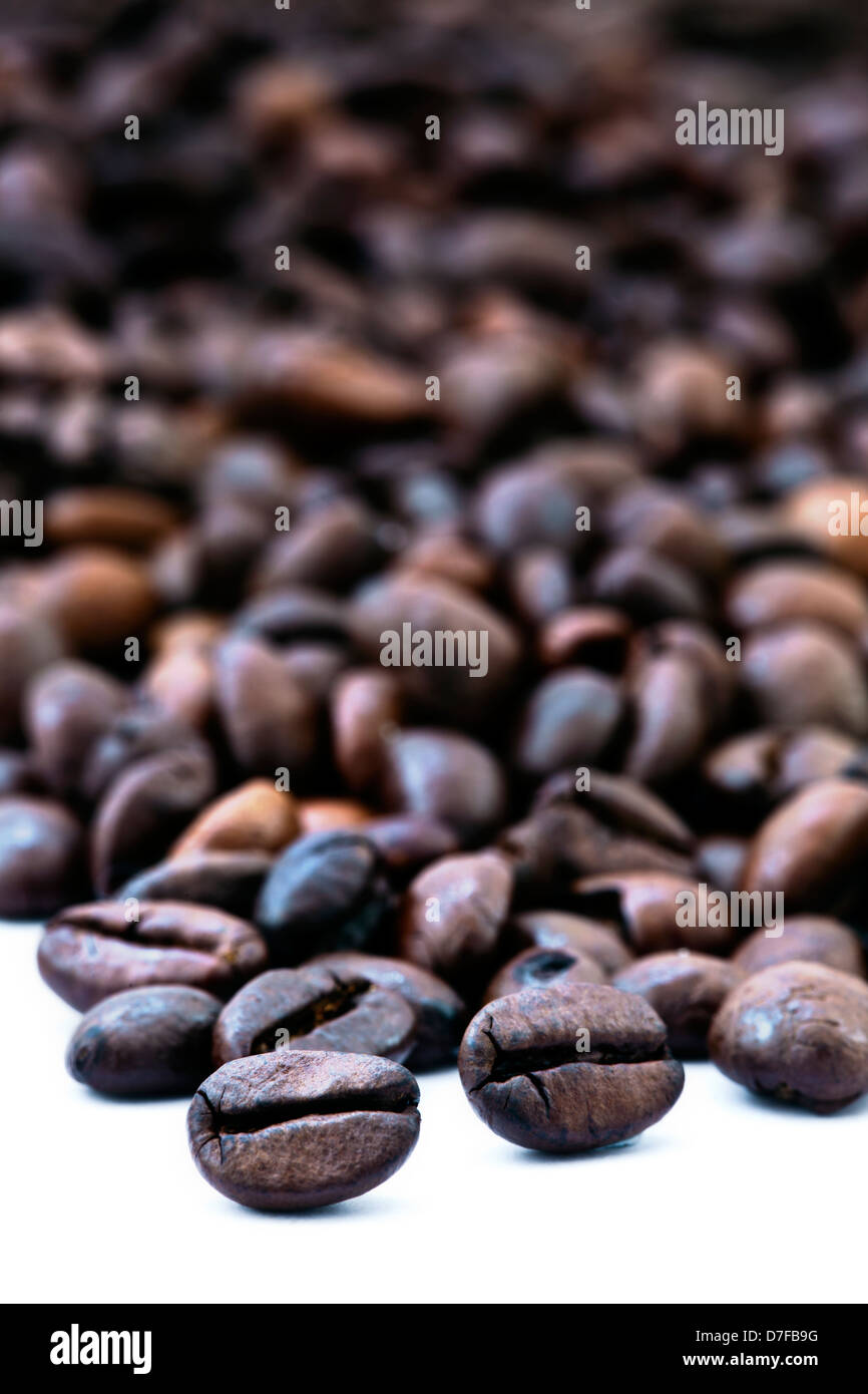 A cluster of fresh roasted coffee beans isolated on white background ...