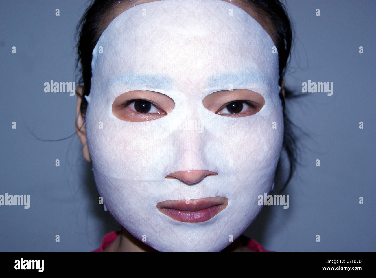 Asian woman with facial mask Stock Photo - Alamy
