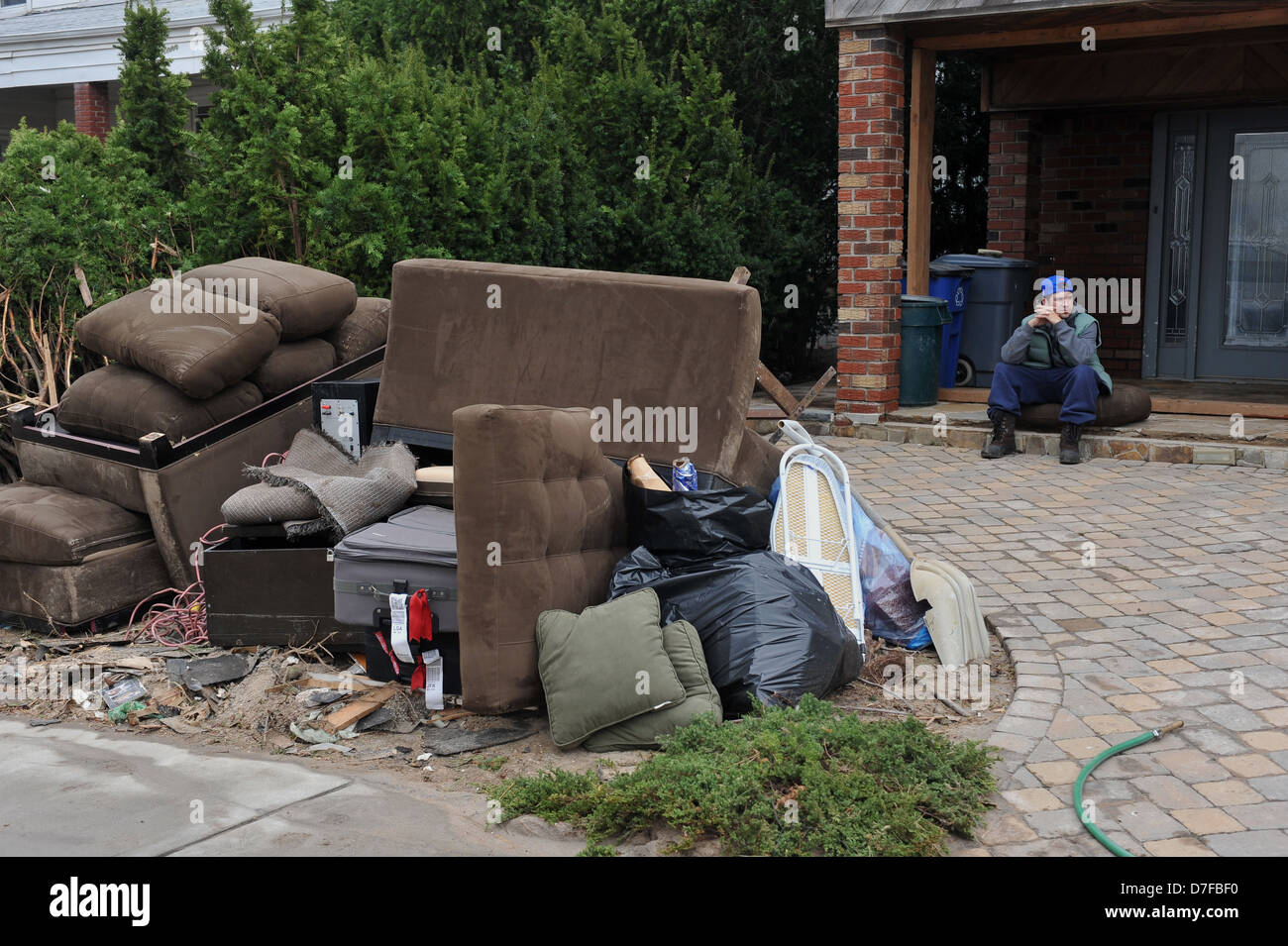 BROOKLYN, NY - NOVEMBER 01: Unknown person sitting sad by his house at ...