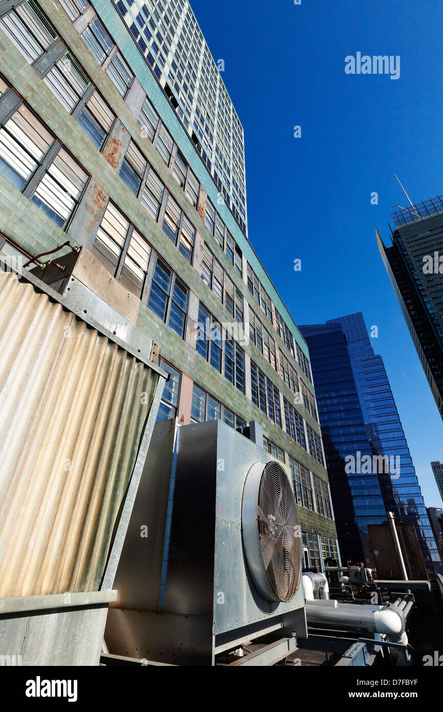 Wide angle view at an outdoor HVAC air conditioner unit located on a ...