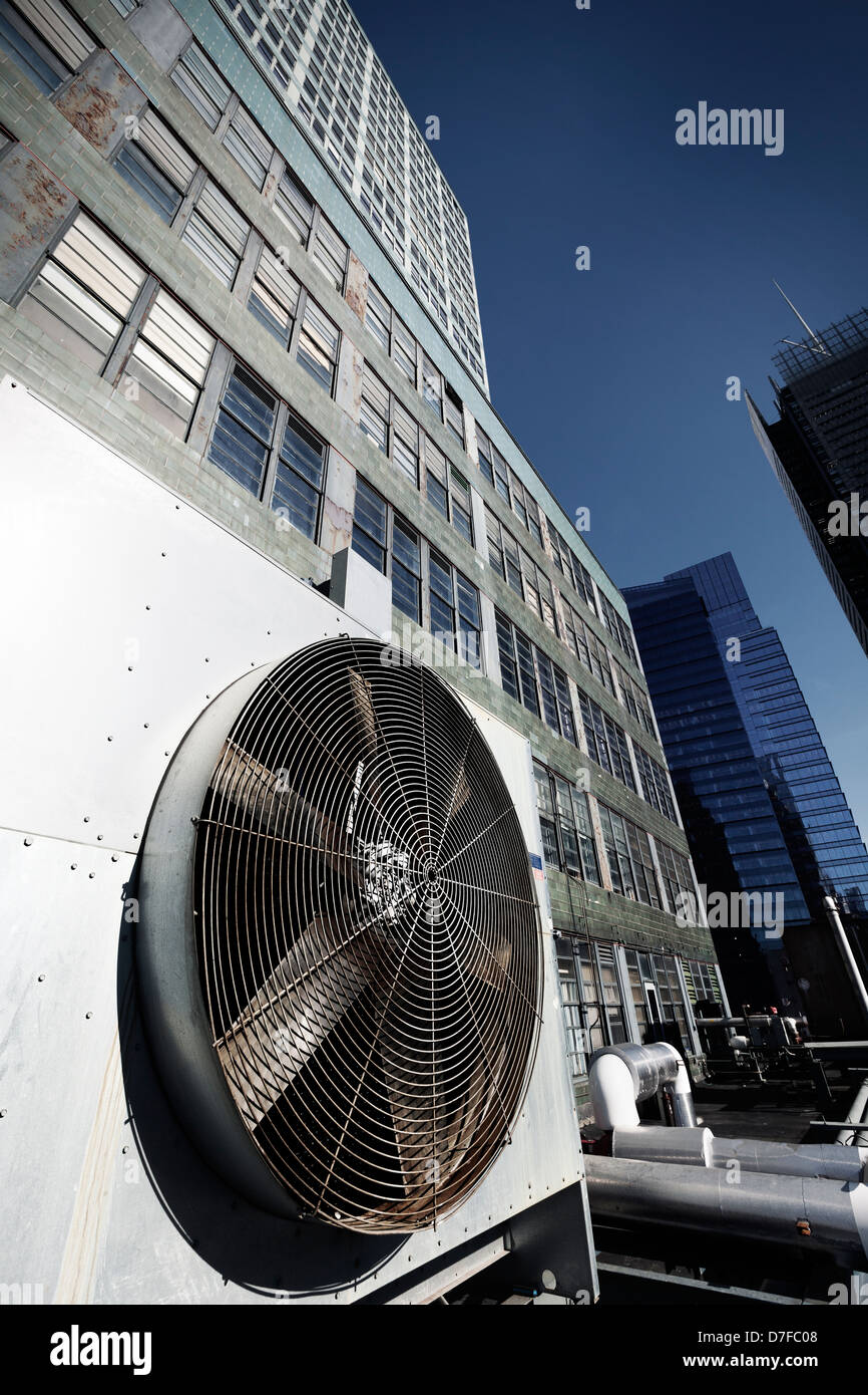 Wide angle view at an outdoor HVAC air conditioner unit located on high ...