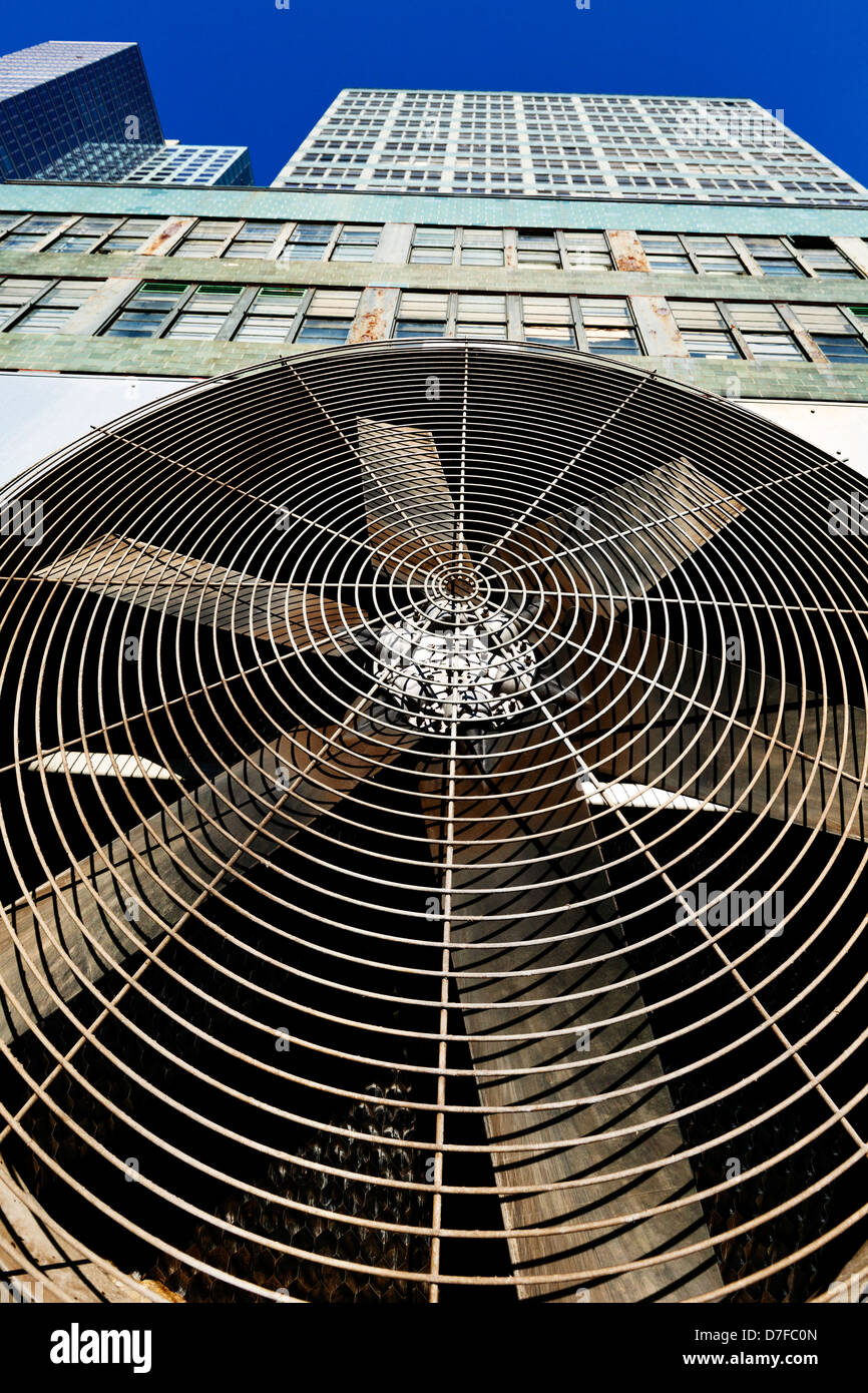 Wide angle view of an outdoor HVAC air conditioner unit located on a ...