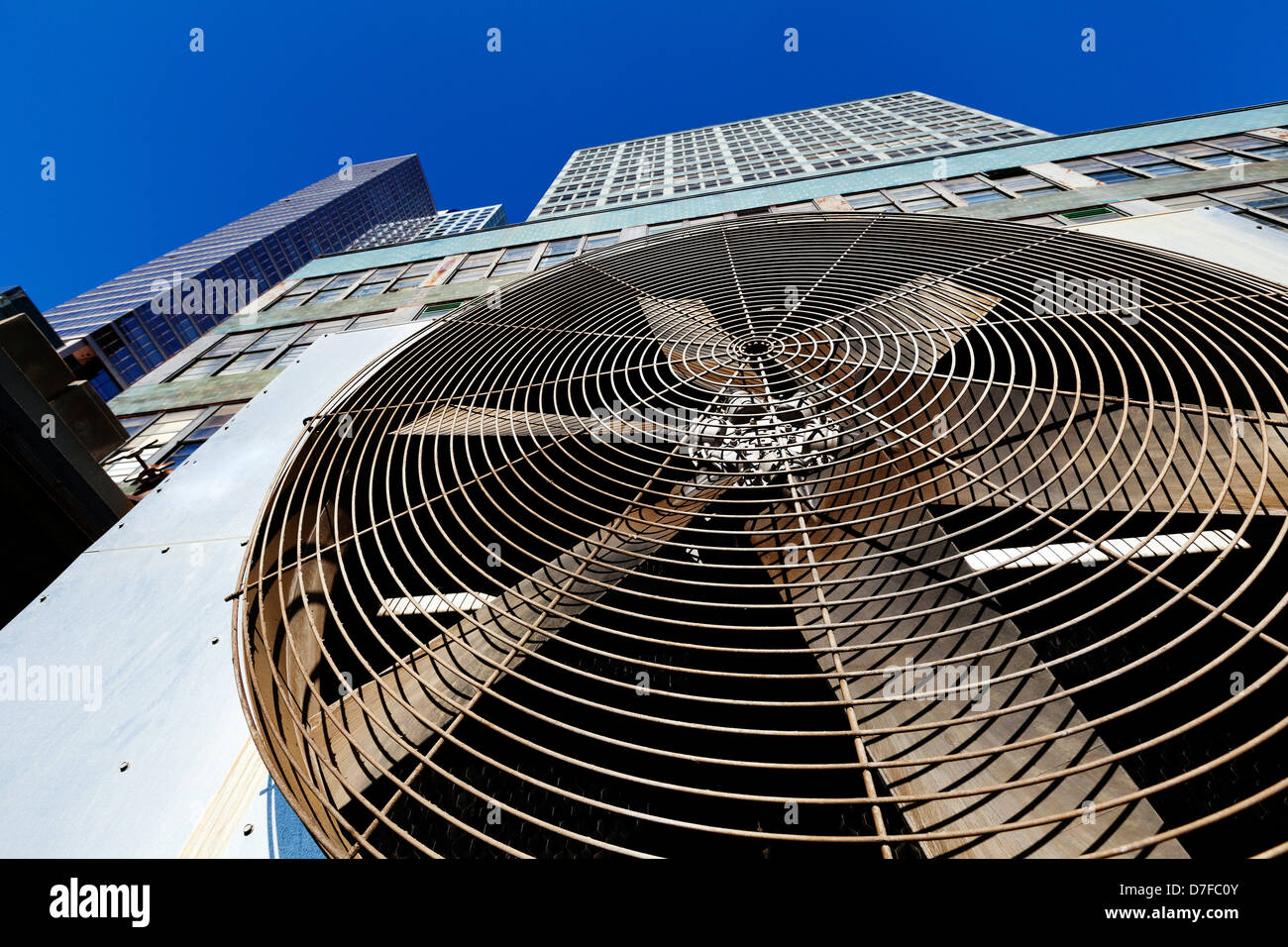 Wide angle view of an outdoor HVAC air conditioner unit located on a ...