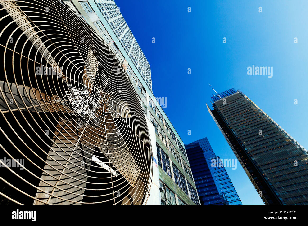 Wide angle view at an outdoor HVAC air conditioner unit located on high ...