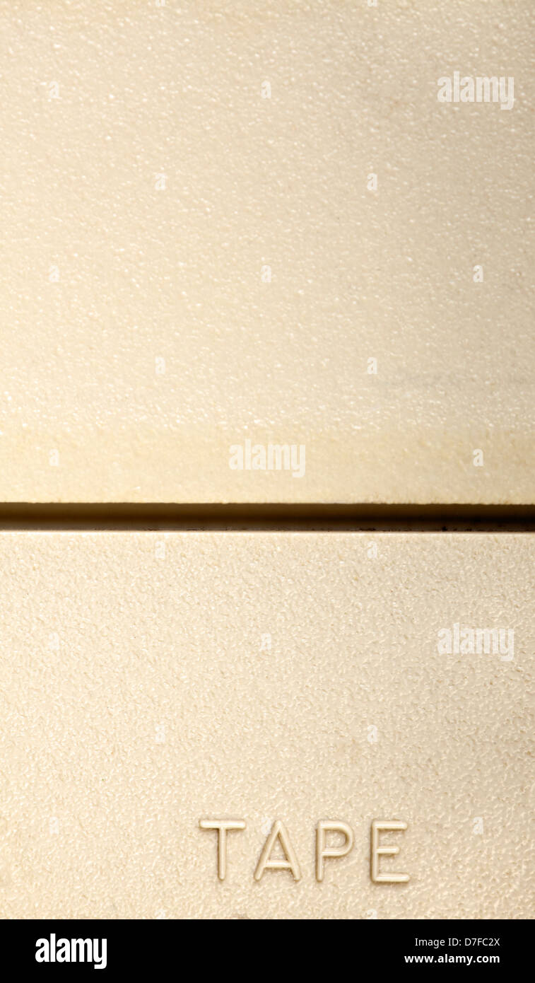 Textured yellow-beige plastic with the text 'tape' at the bottom in ...