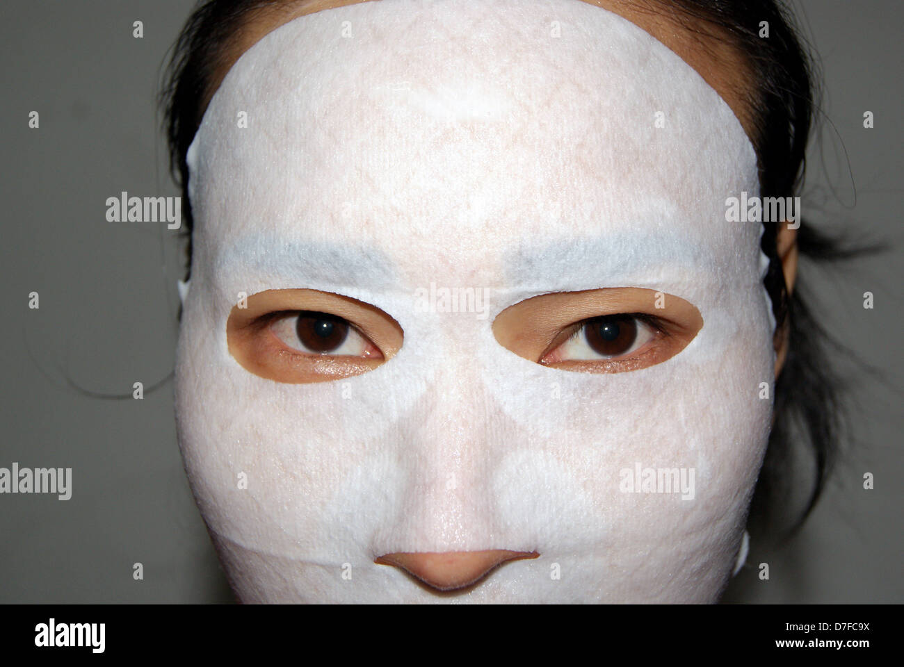 Asian woman with facial mask Stock Photo - Alamy