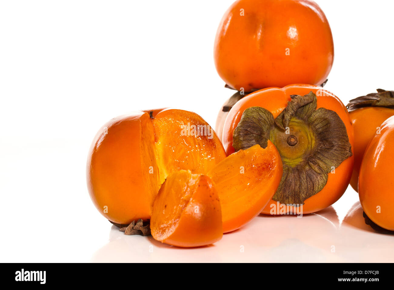 fresh persimmon fruit on a white background Stock Photo - Alamy