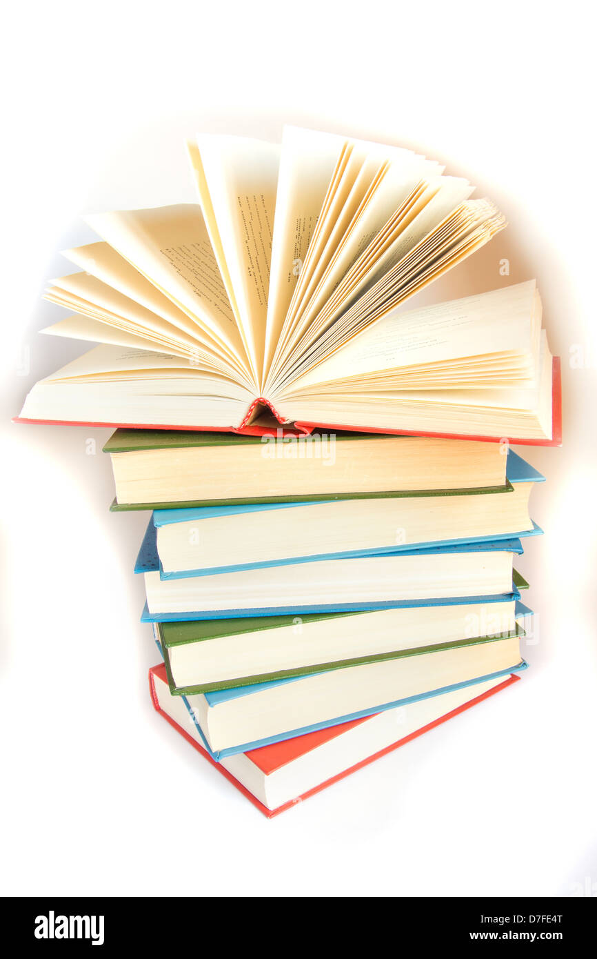 Stack of hard-covered multicolored books isolated over white background Stock Photo - Alamy