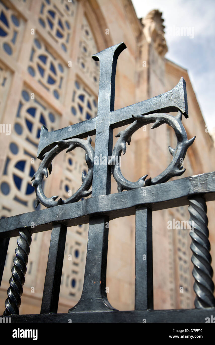 A metal crucifix as part gate decoration on background Church All ...