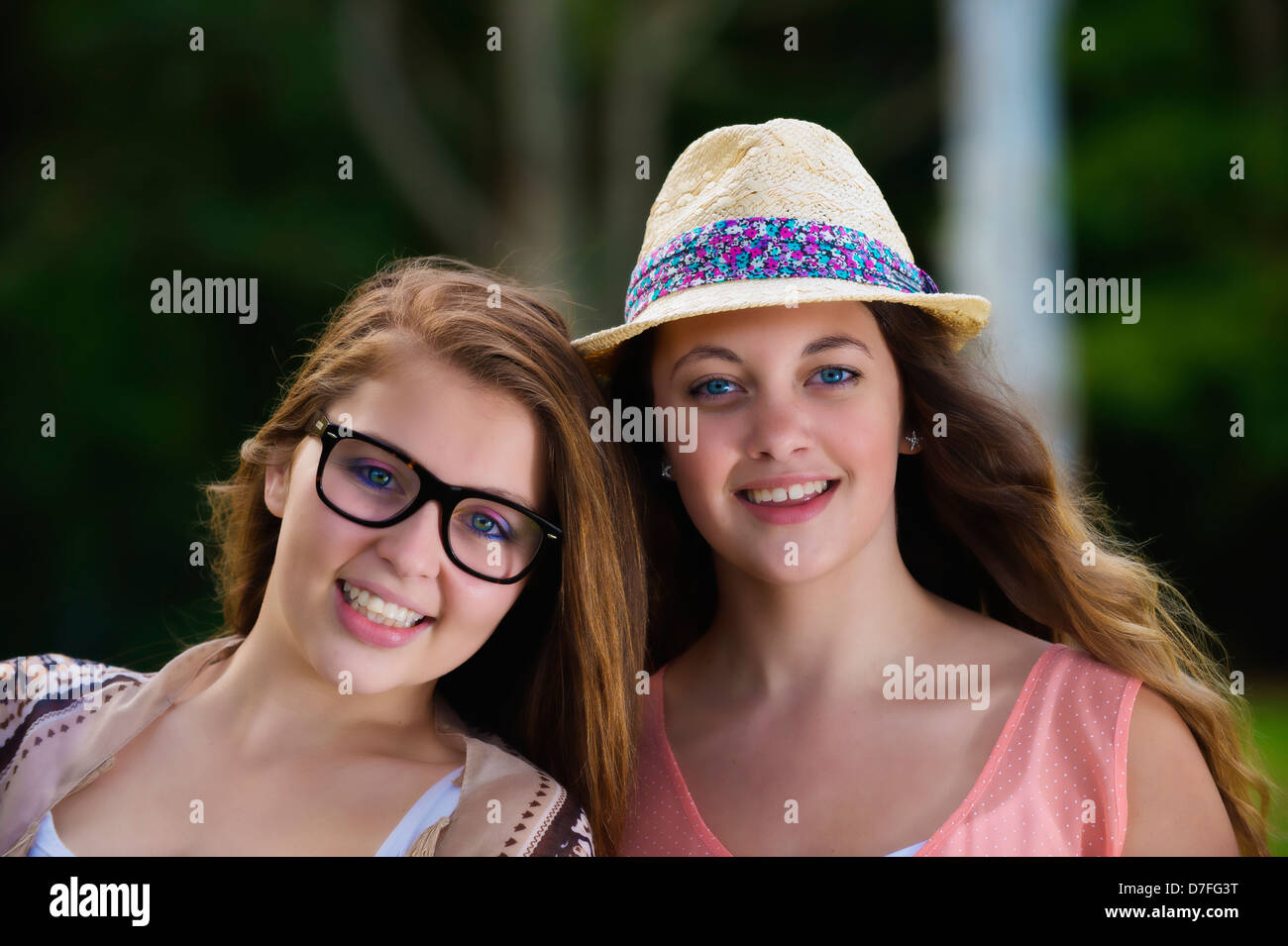 Two young teenage girls pose for a portrait Stock Photo - Alamy